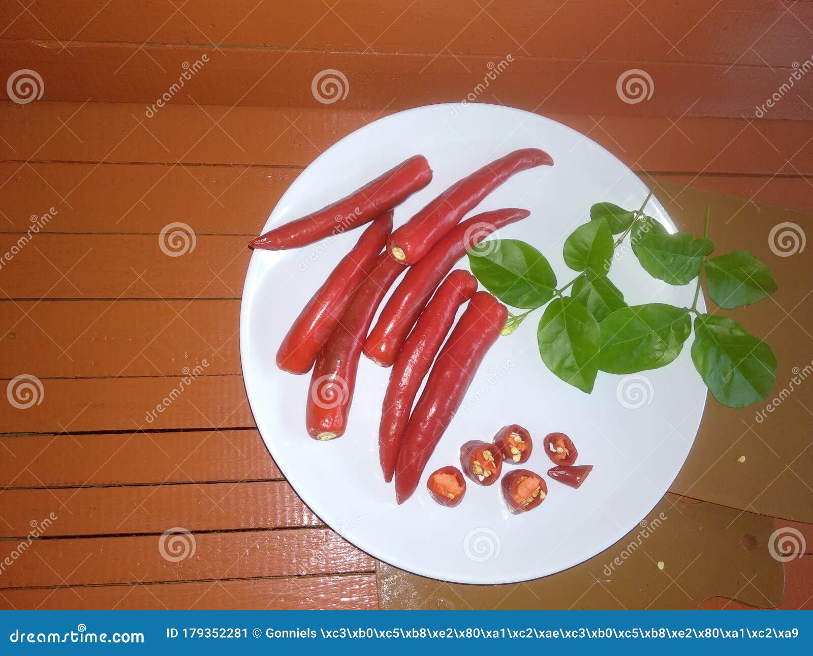 Big red chilli stock image. Image of leaf, green, plate - 179352281