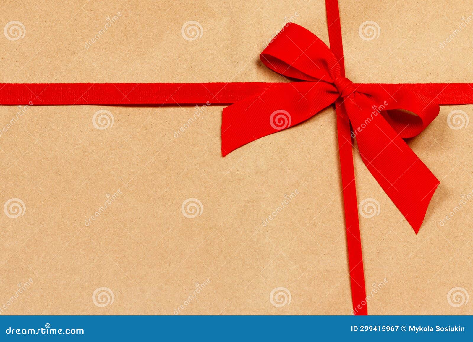 Big Red Holiday Bow on Brown Box Background Top View Vith Copy Space ...