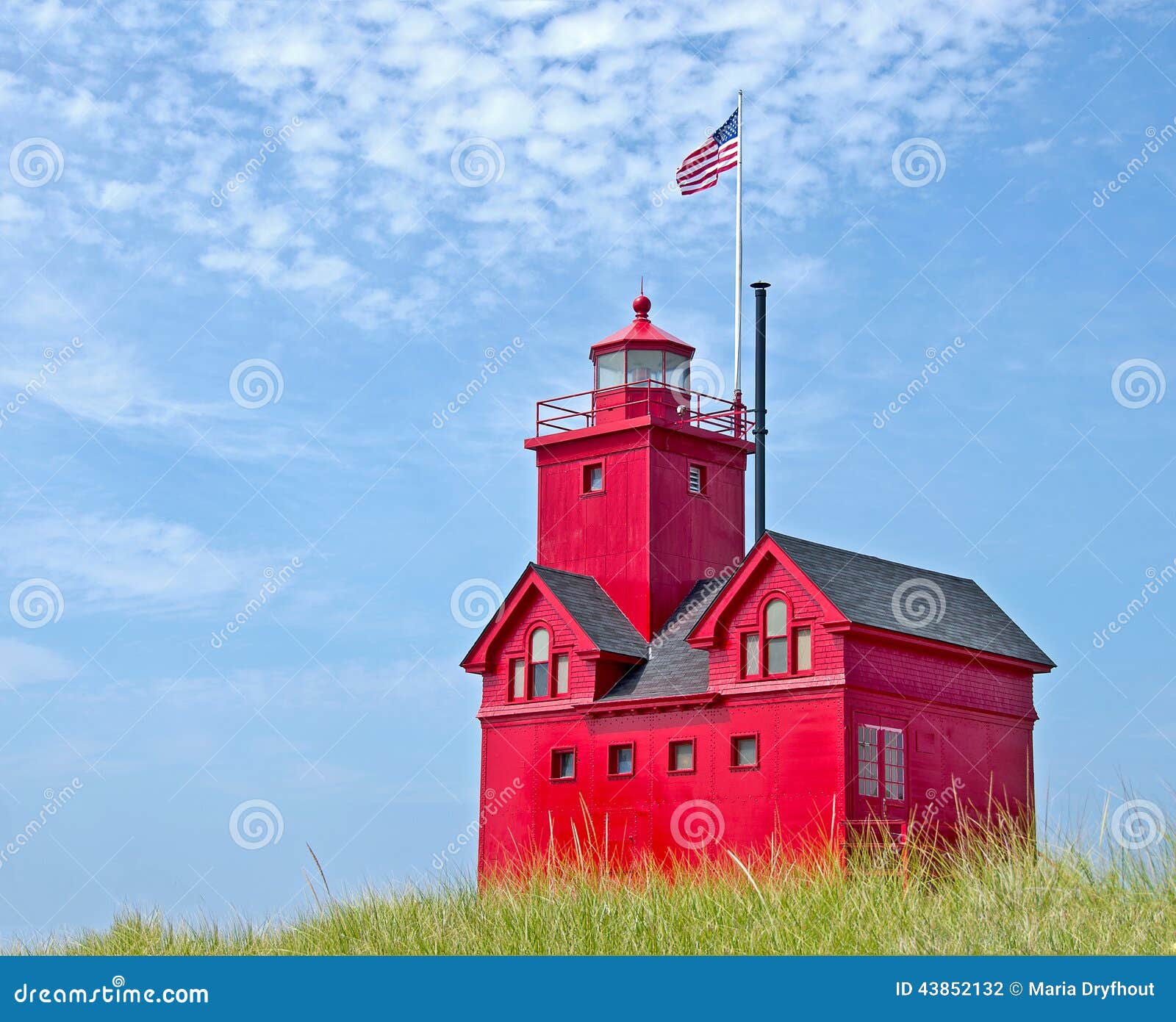 Big Red Lighthouse in Michigan Stock Photo - Image of building, flag ...