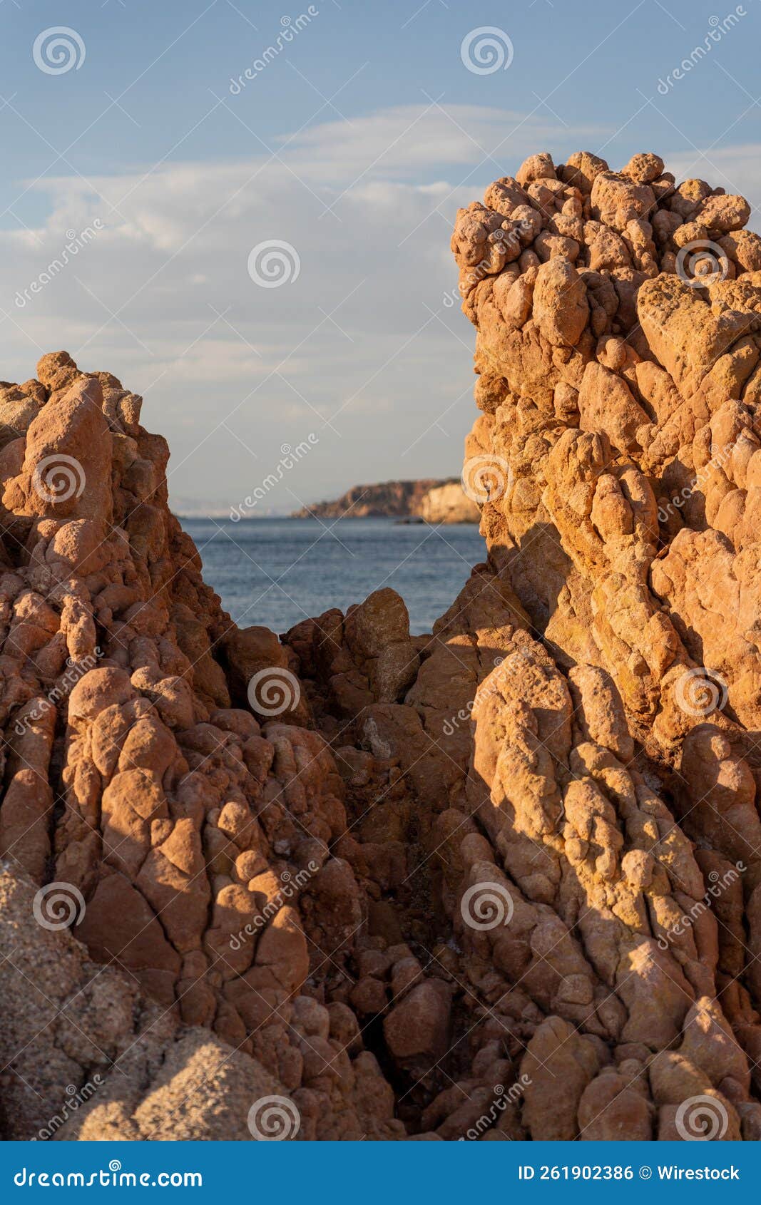 Big red rocks by the beach stock photo. Image of tropical - 261902386