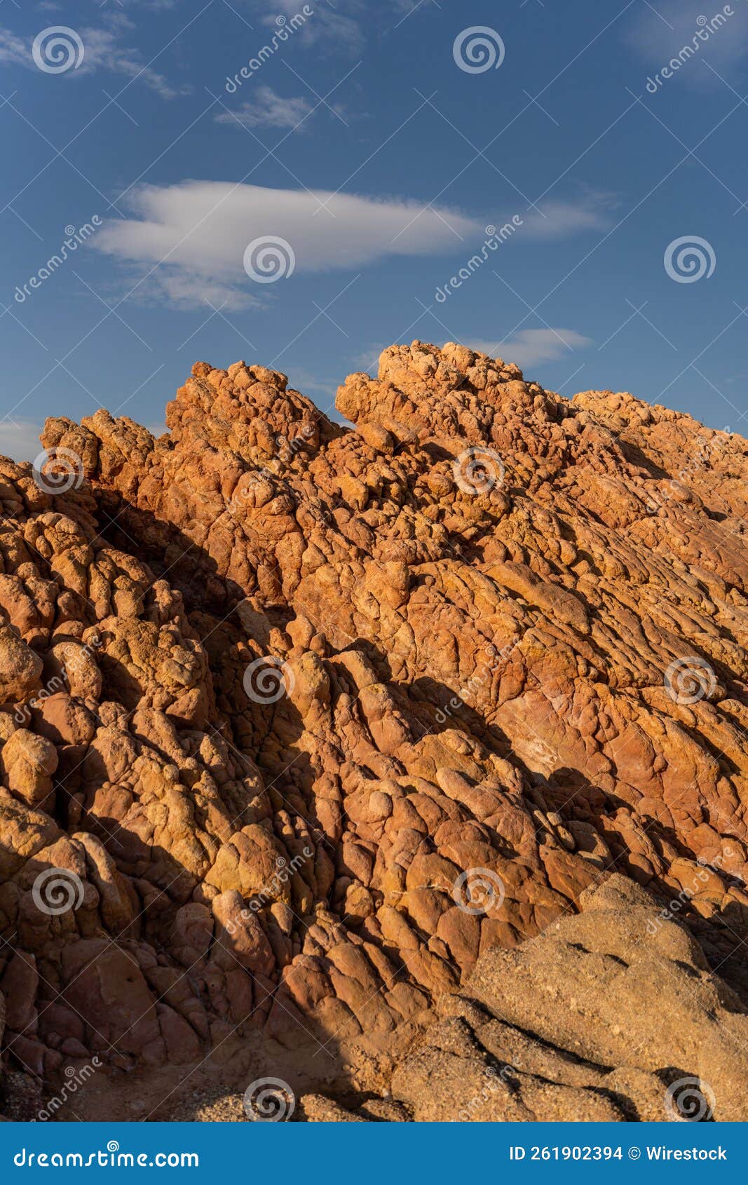 Big red rocks by the beach stock photo. Image of coast - 261902394