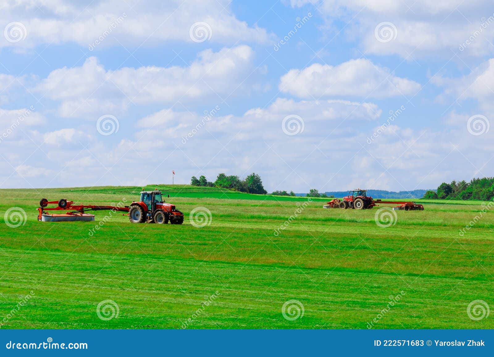 Big Red Tractor with Two Mowers Mows the Grass for Silage Stock Image ...
