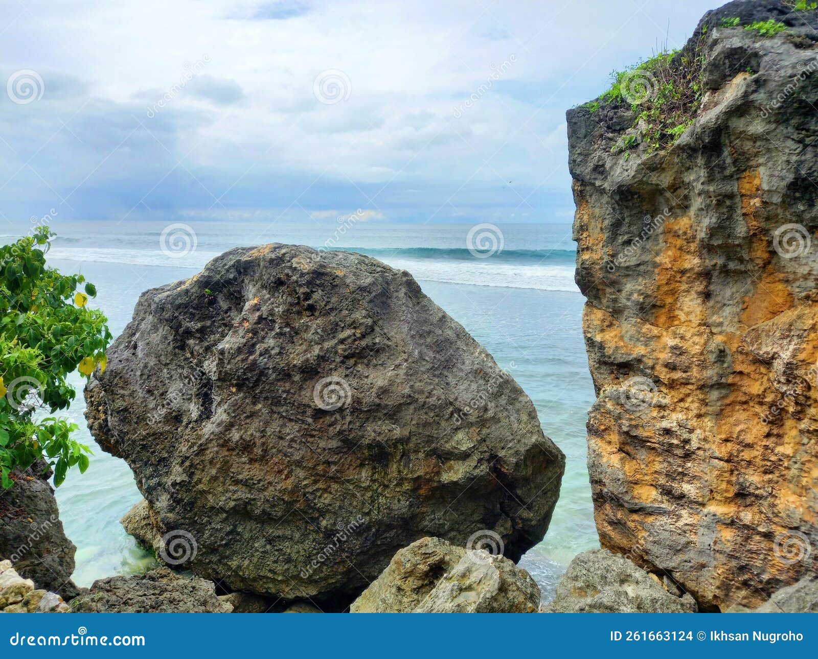 Big rock on the beach stock photo. Image of colorful - 261663124