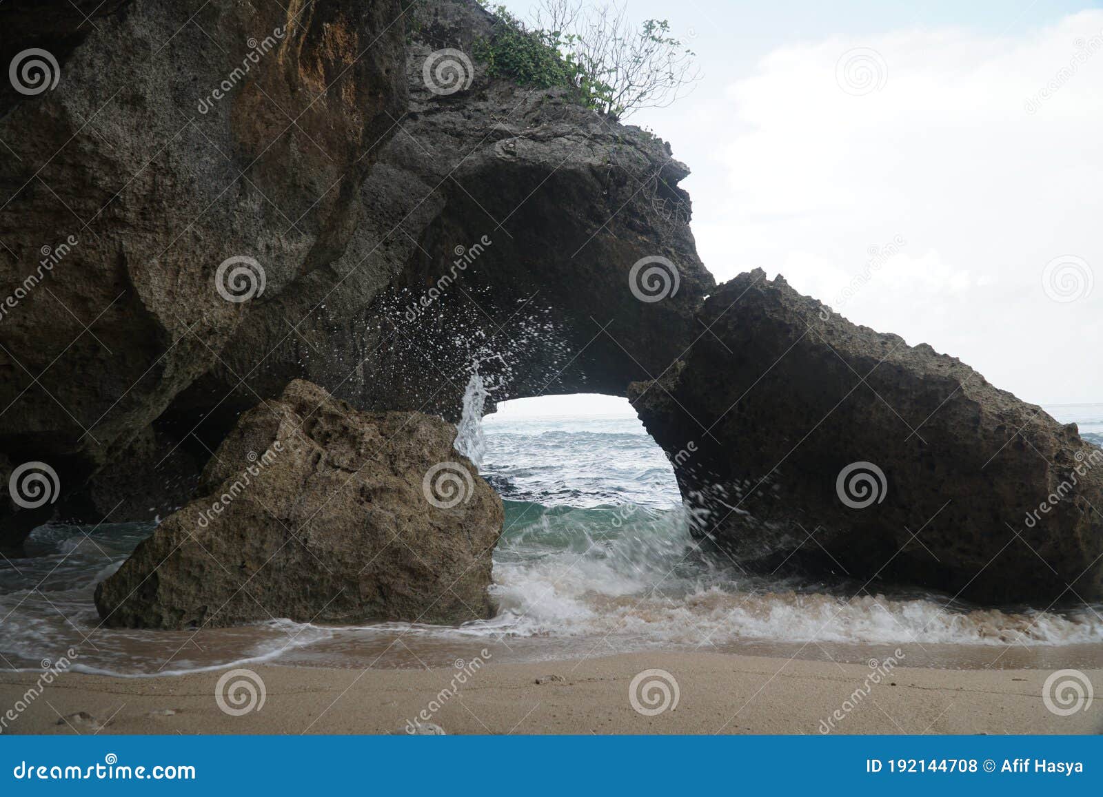 Big rock in the beach stock photo. Image of shore, sandy - 192144708