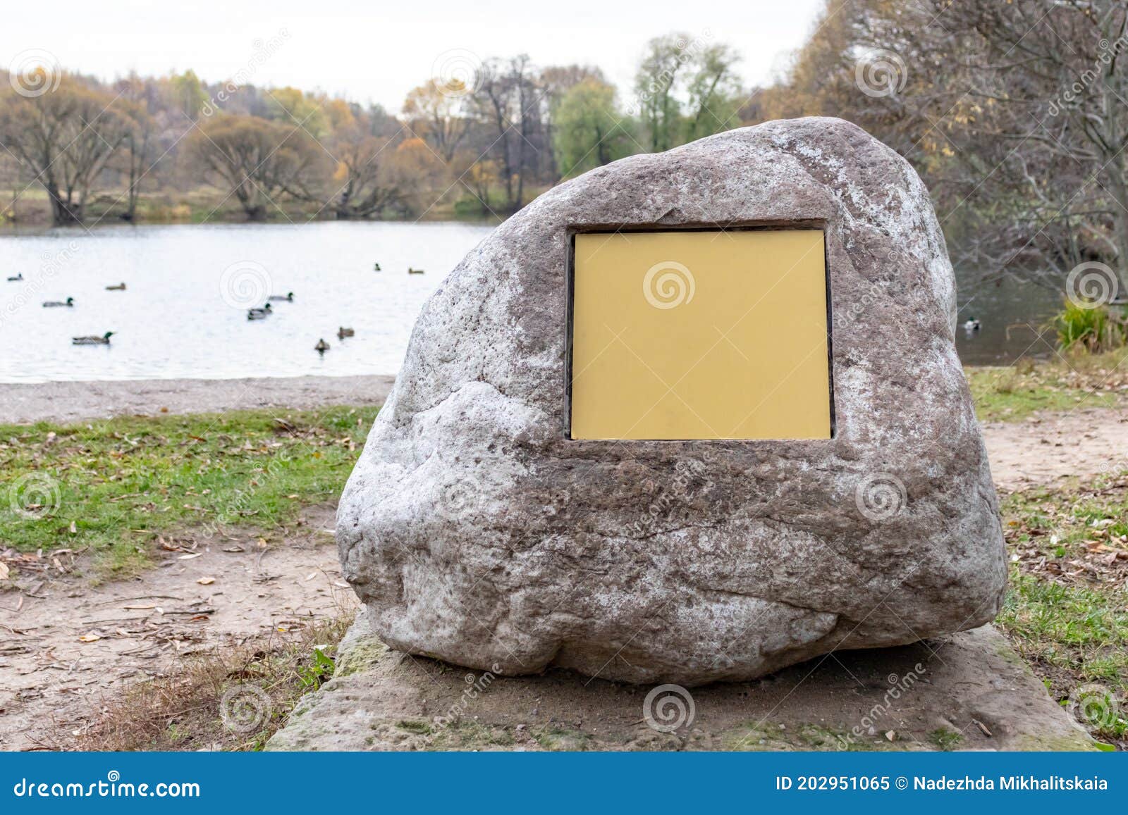 A Big Rock Stone with an Empty Signboard on it with Copy Space Stock ...