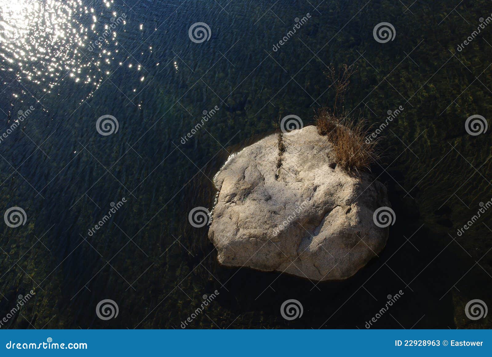 A big rock in water stock image. Image of sunshine, nature - 22928963