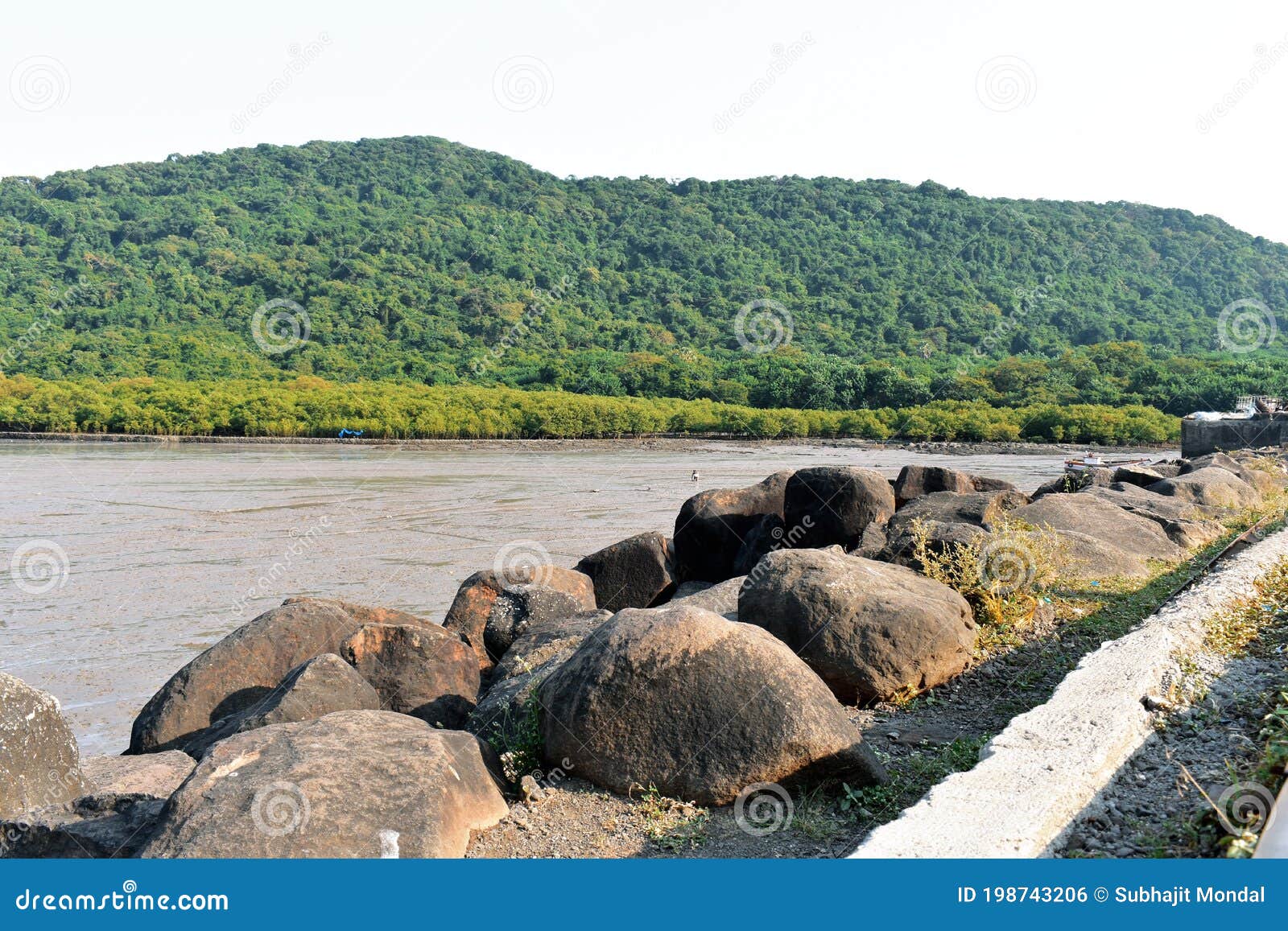 Big Rocks Kept on the Edge To Stop Big Waves from the Ocean Stock Photo ...