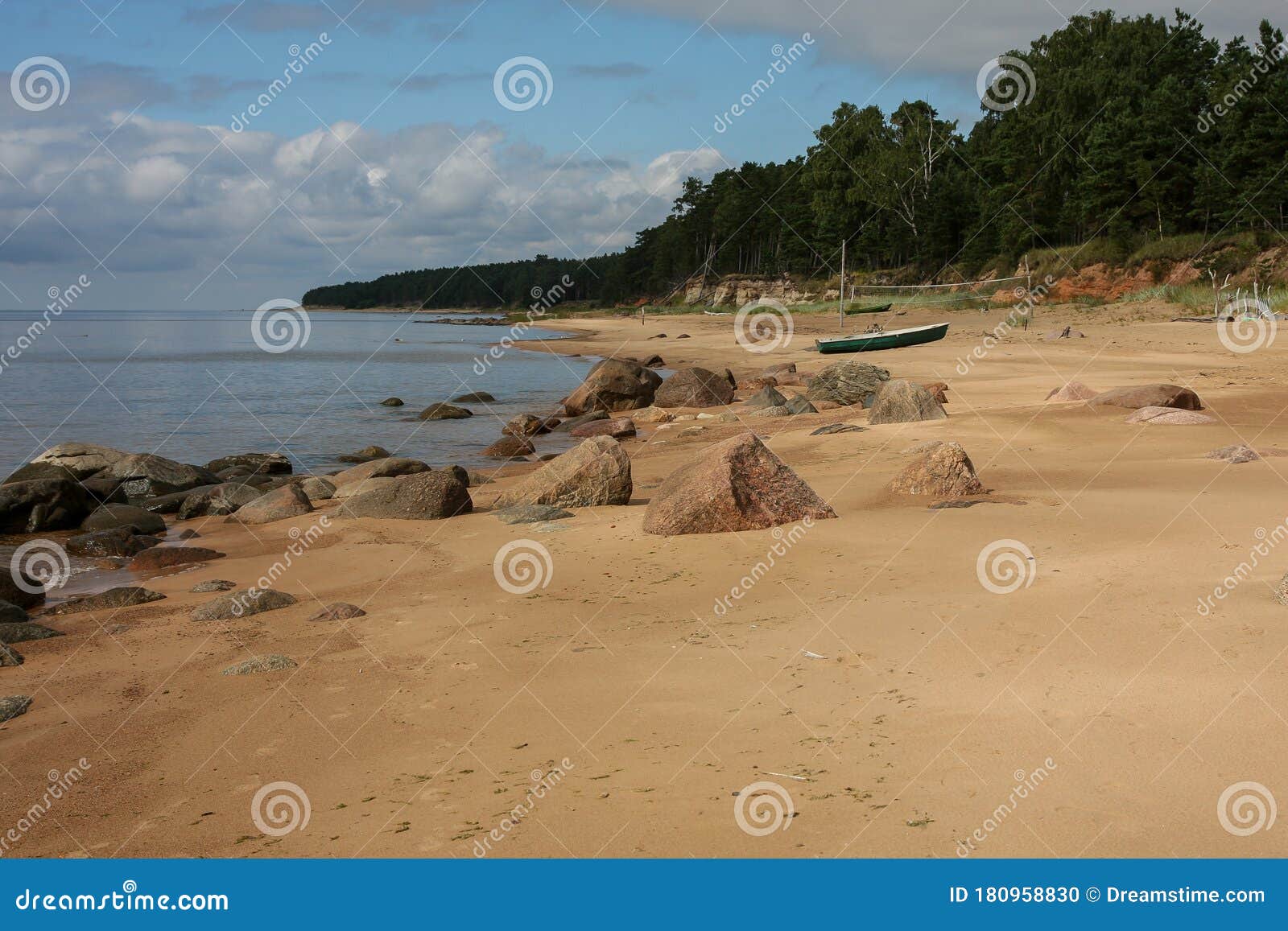 Big rocks on a sandy beach stock photo. Image of beach - 180958830