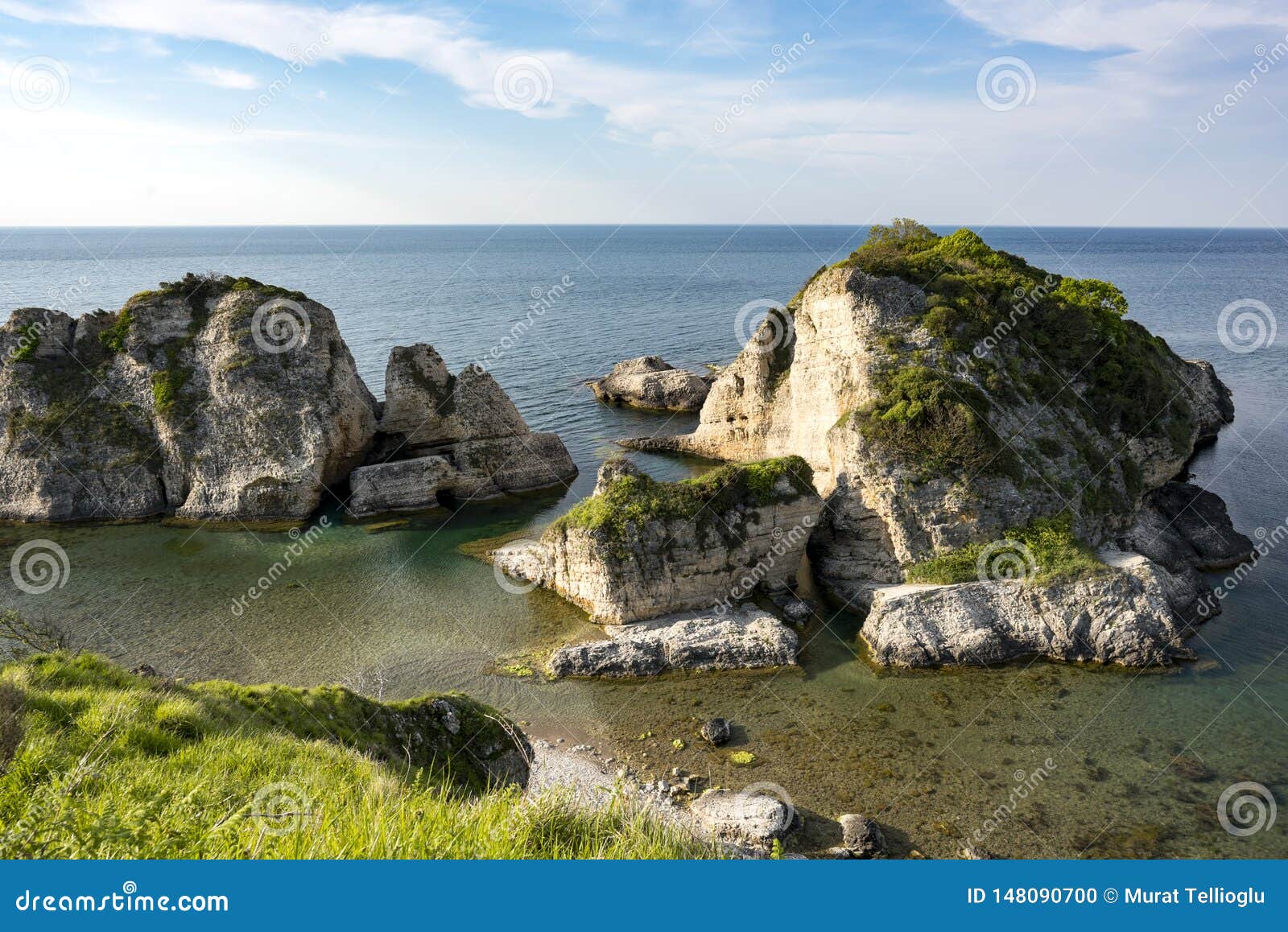 Big rocks in the sea stock photo. Image of light, cloud - 148090700