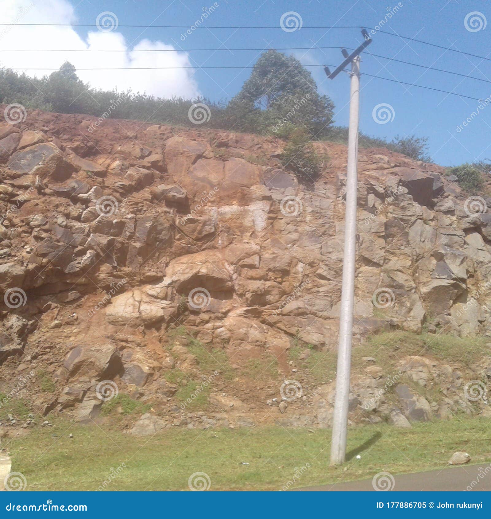 Big Rocks on Sides of Road and Clouds on Top Stock Image - Image of ...