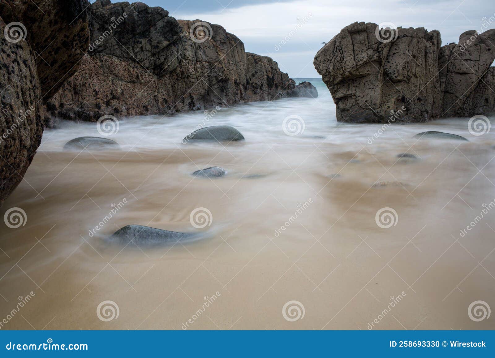 Big Rocks in the Water Surrounded by Rocky Cliffs in Isle of Harris ...