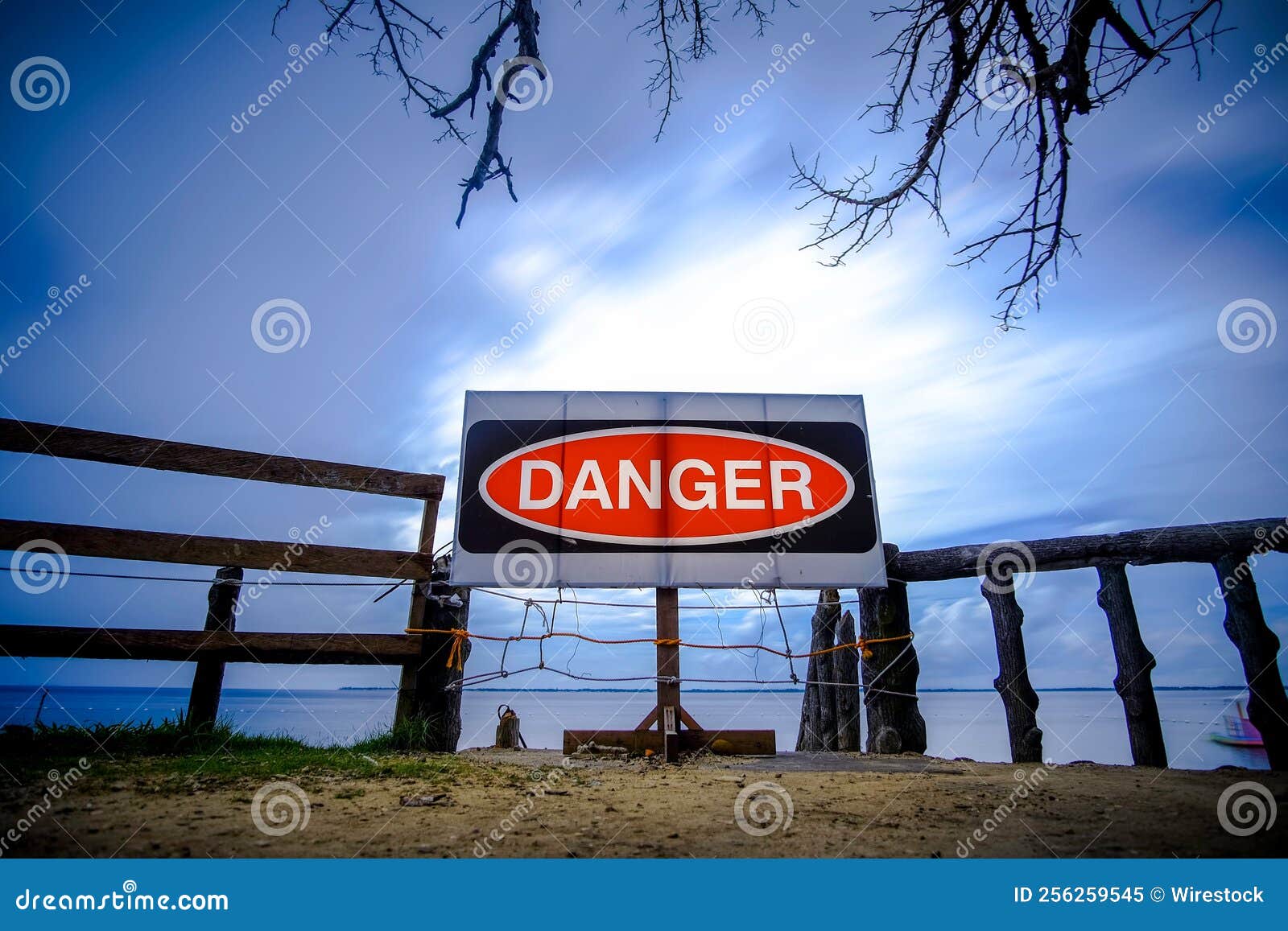 Big Sign with a "Danger" Warning Text in Cloudy Sky Background Stock ...