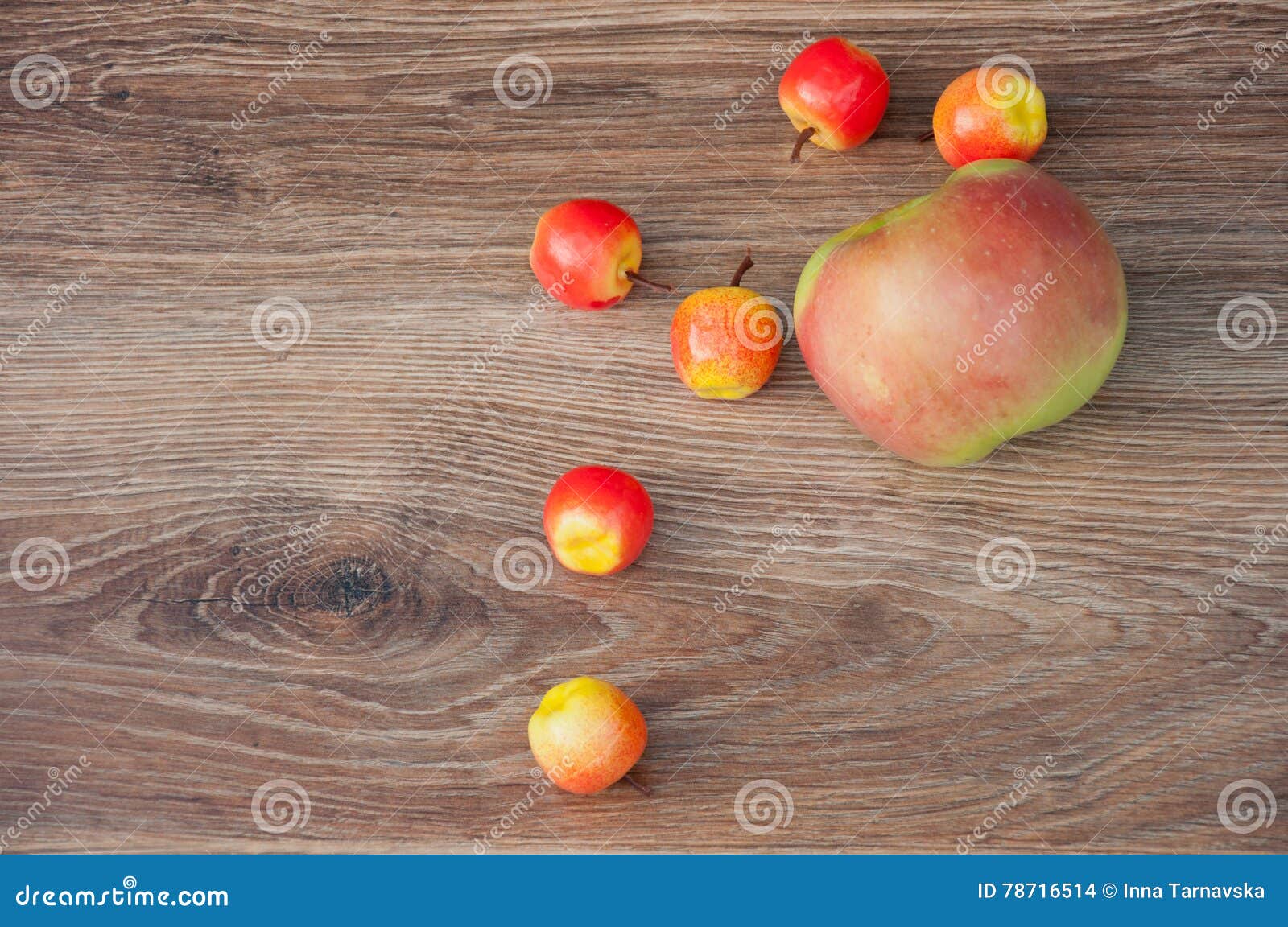 Big and Small Apples on Wooden Table Stock Photo - Image of food ...