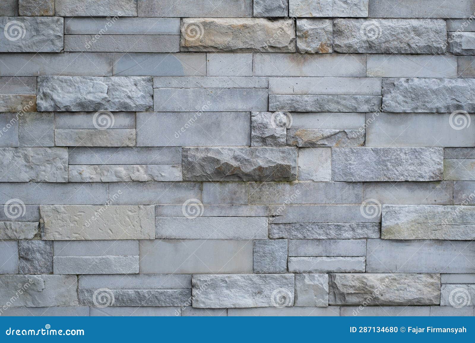 Big and Small Bricks in a Grey Stone Wall Stock Photo - Image of front ...