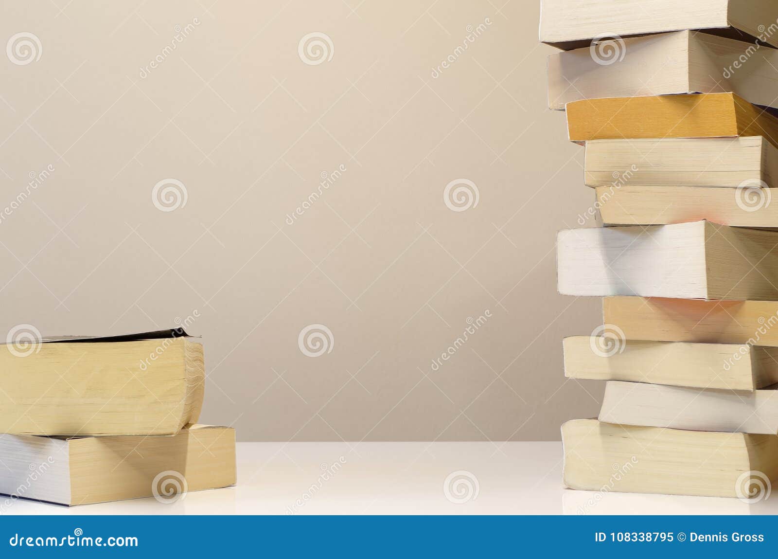 Big and Small Pile of Books on White Table Stock Image - Image of ...