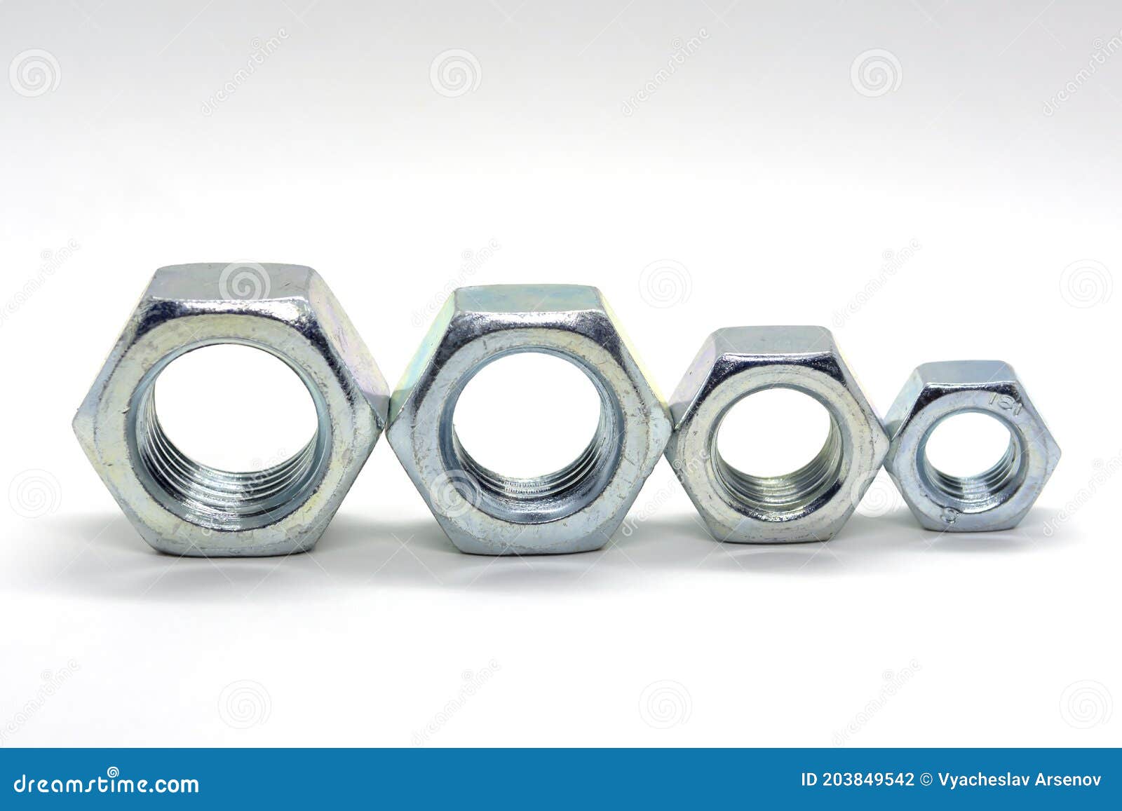 Big and Small Screw-nut. Concept. White Background Stock Photo - Image ...