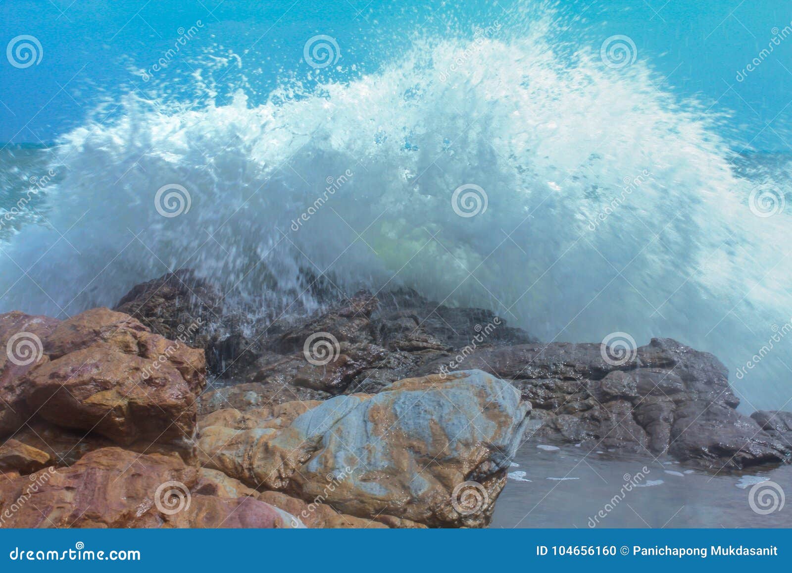 Big splash wave hit rock stock photo. Image of view - 104656160