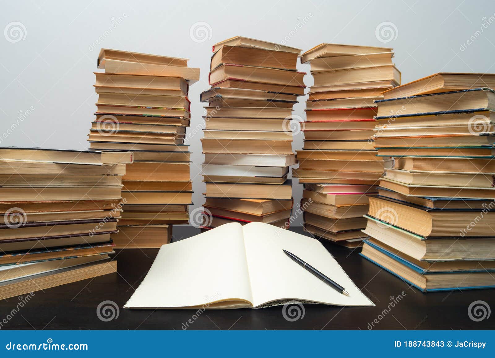 Big Stack of Books on the Table. Studying before the Exam. Pile of ...