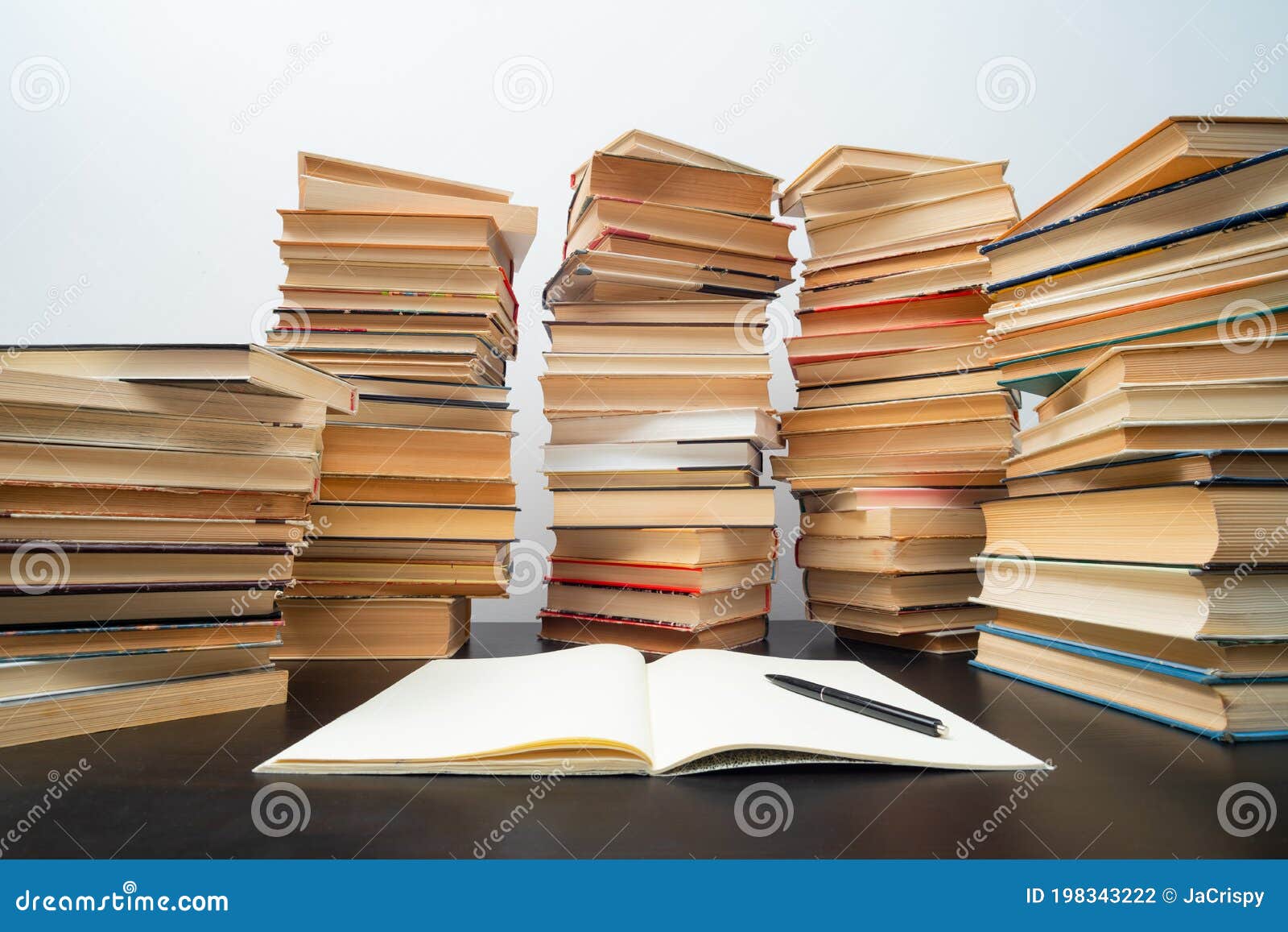 Big Stack of Books on the Table. Studying before the Exam. Pile of ...