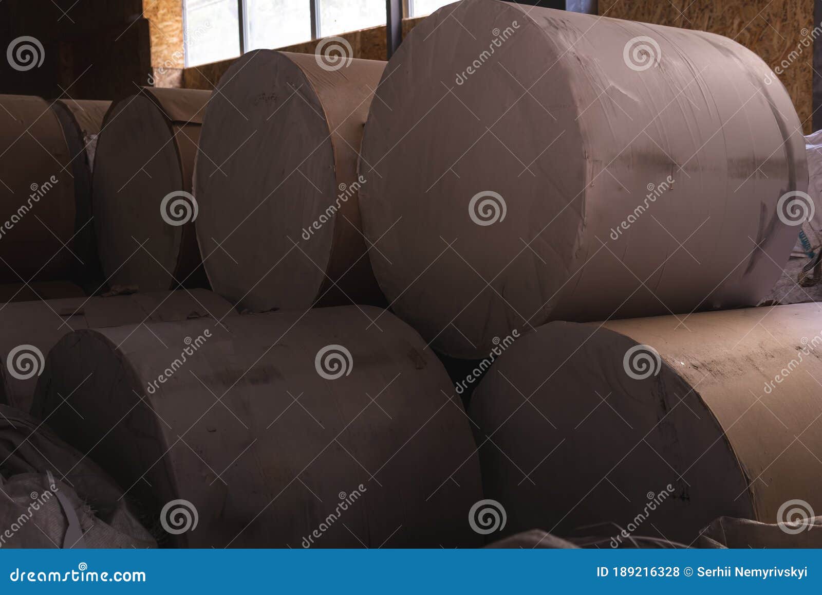 Big Stack of Printing Paper Rolls in Warehouse. the Concept of ...