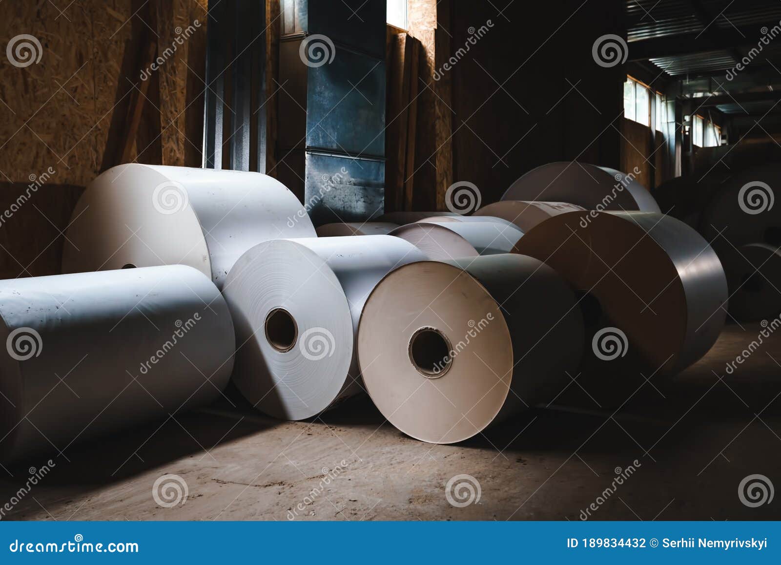 Big Stack of Printing Paper Rolls in Warehouse. the Concept of ...