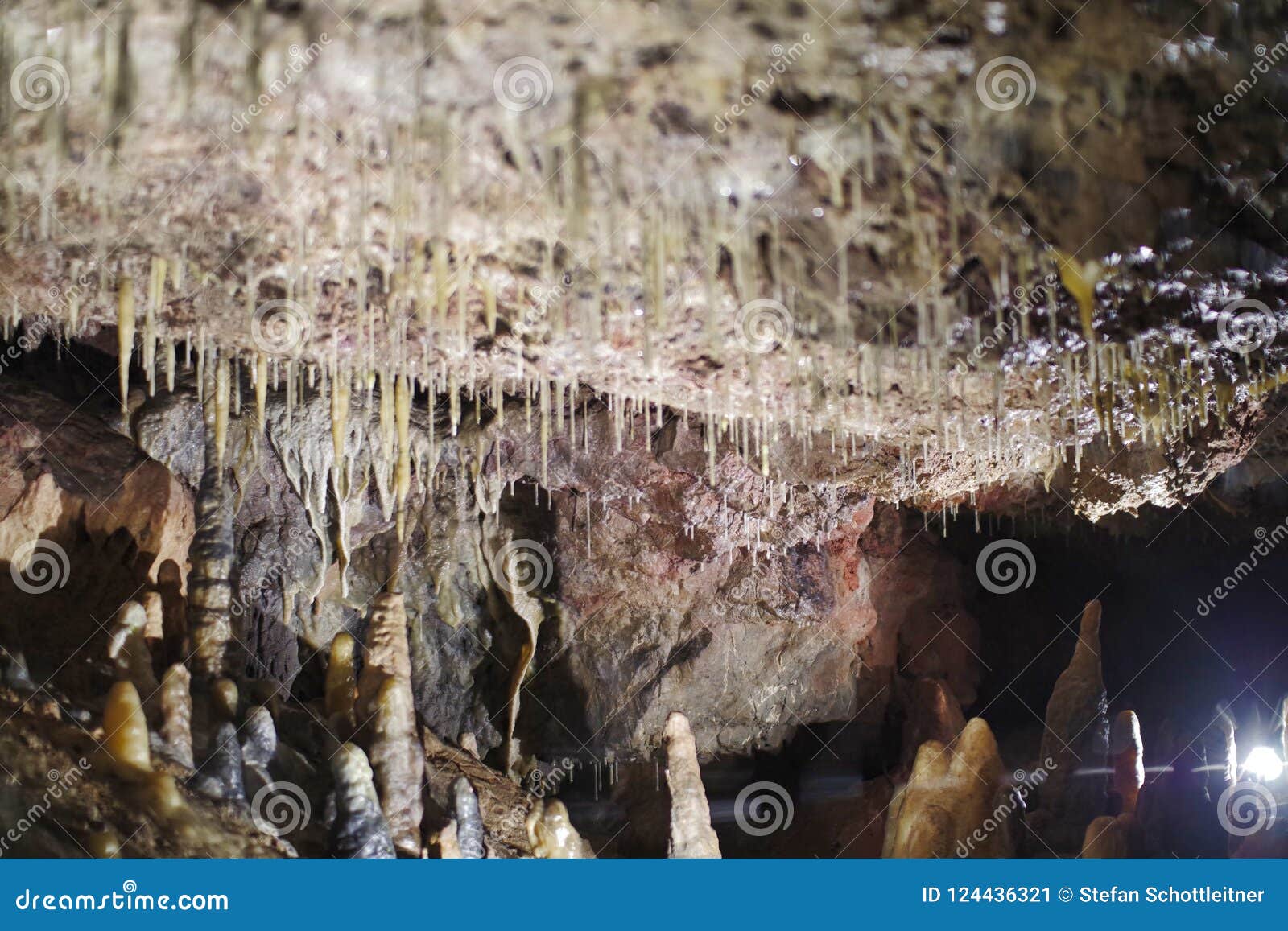 A Big Stalactite is Hanging from the Rock Stock Image - Image of ...