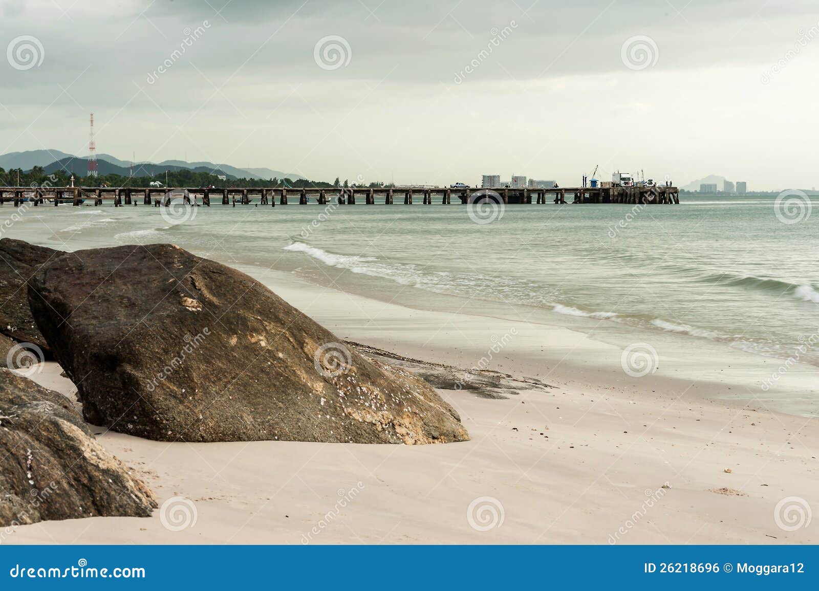 Big Stone in Sand on Beach with Jetty Stock Photo - Image of horizon ...