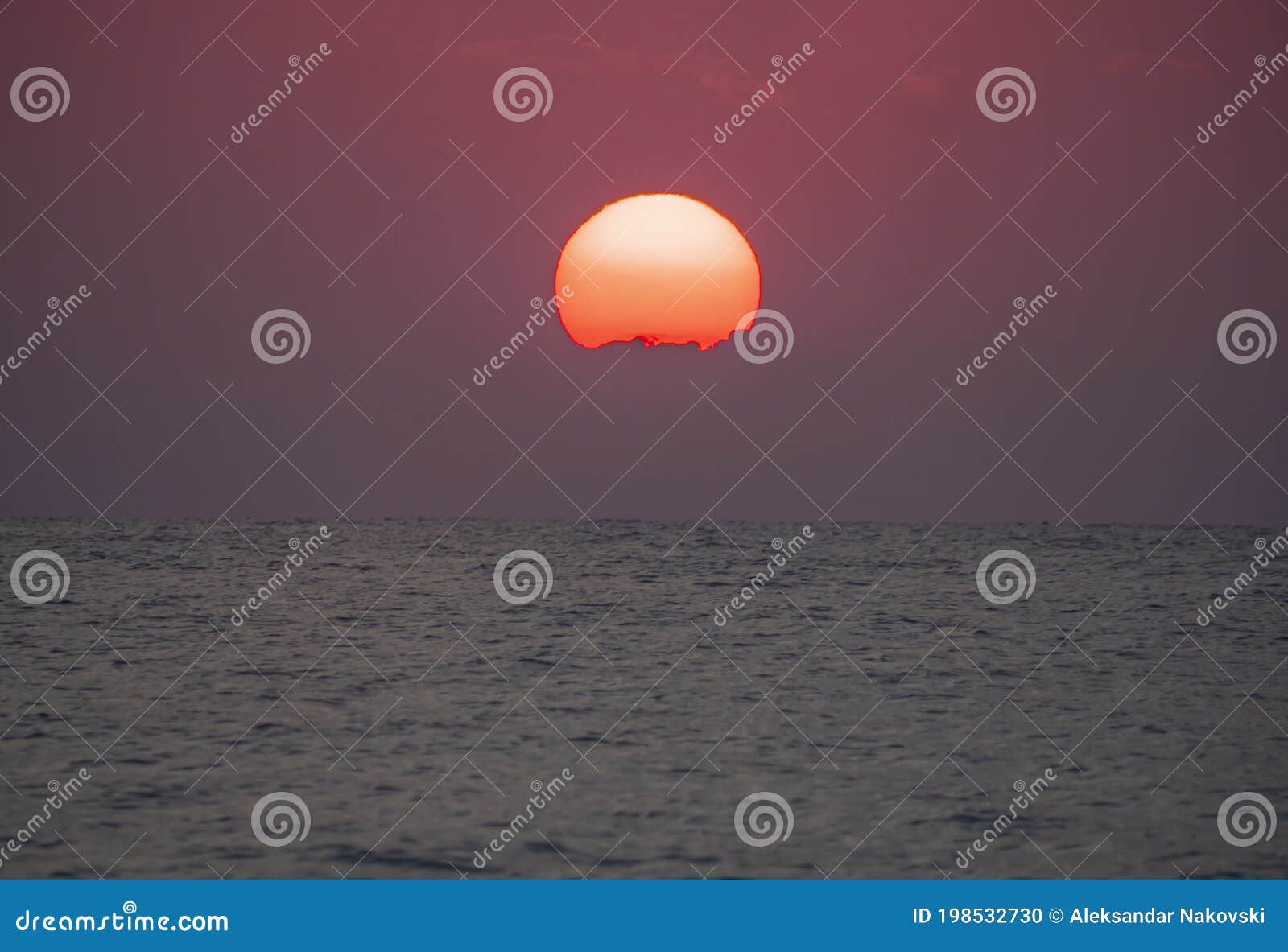 Big sun over sea sunrise stock photo. Image of scenery - 198532730