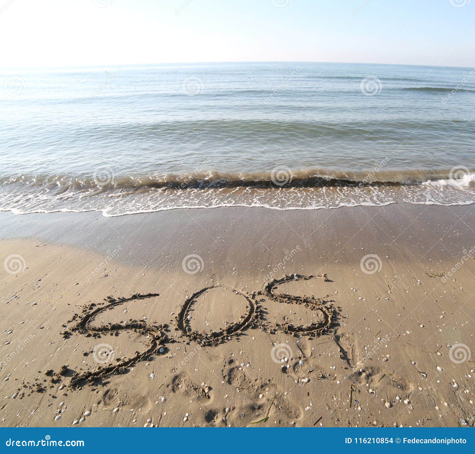 SOS on the Sand of the Beach Stock Photo - Image of wide, wave: 116210854