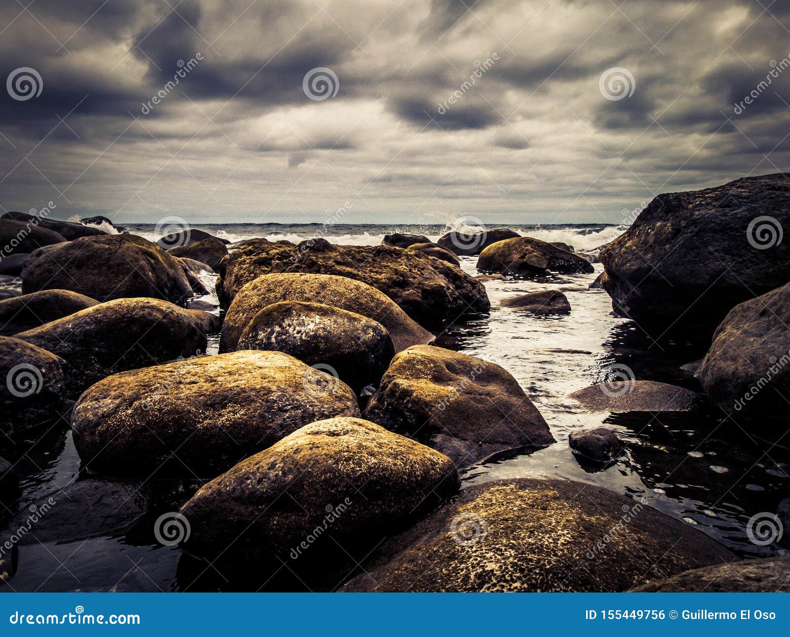 Big View Over a Rock Beach with Fantastic Clouds on the Sky Stock Photo ...