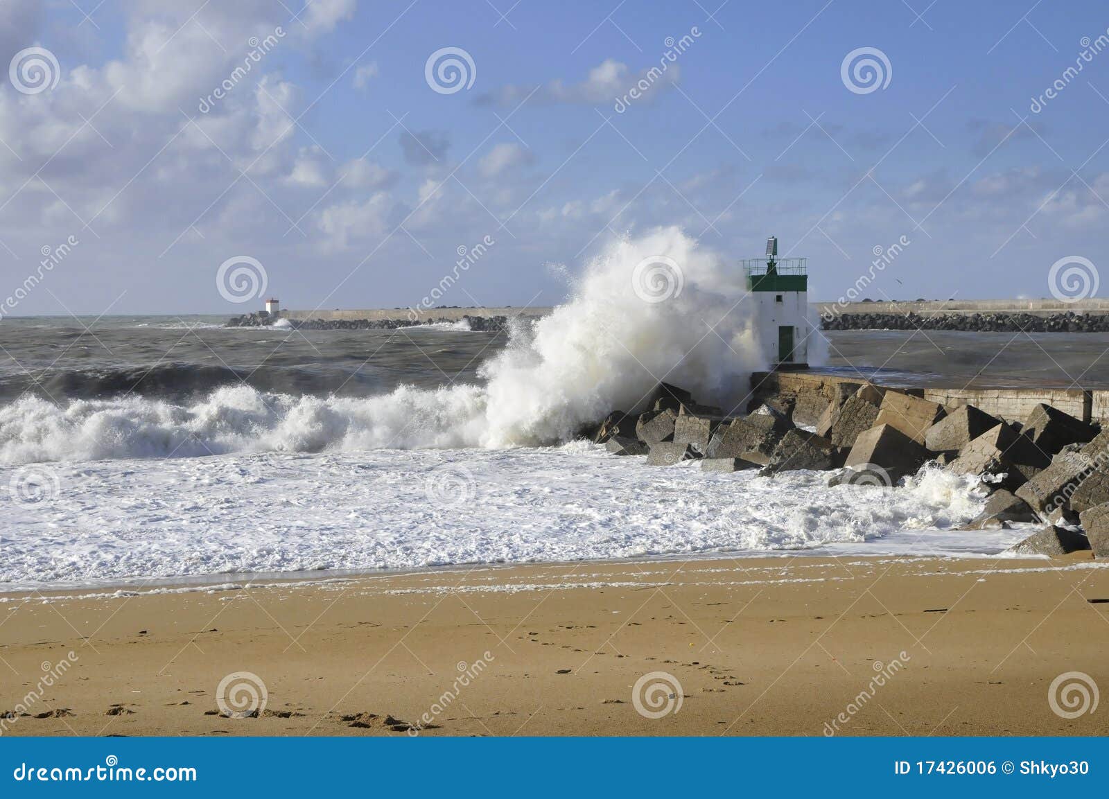 Big Wave on a Little Lighthouse Stock Photo - Image of strike, beach ...
