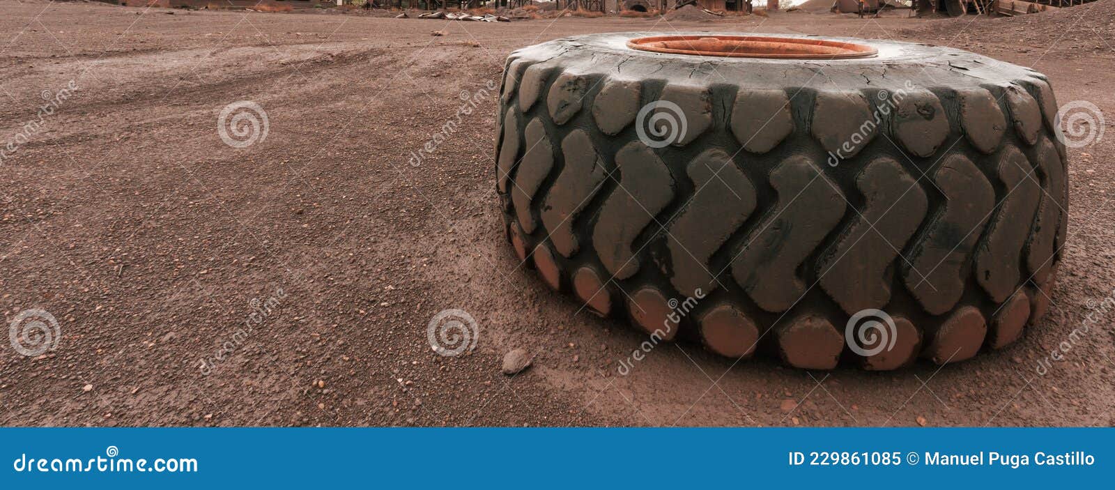 Big Wheel Lying on the Ground in the Field. Stock Image - Image of ...