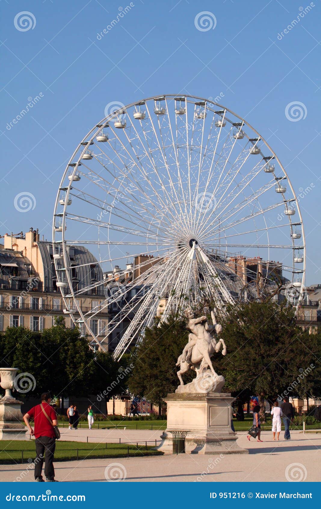 Big wheel and statue editorial photo. Image of kids, round - 951216