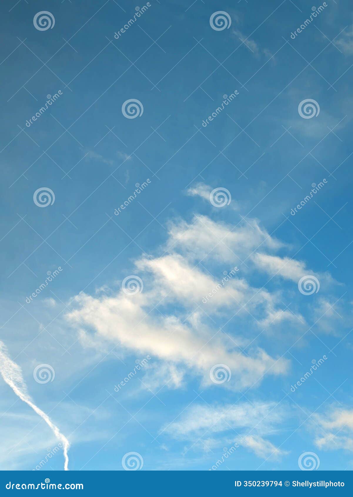 Big White Fluffy Clouds on a Blue Sky with Fine Whispy Lines Stock ...