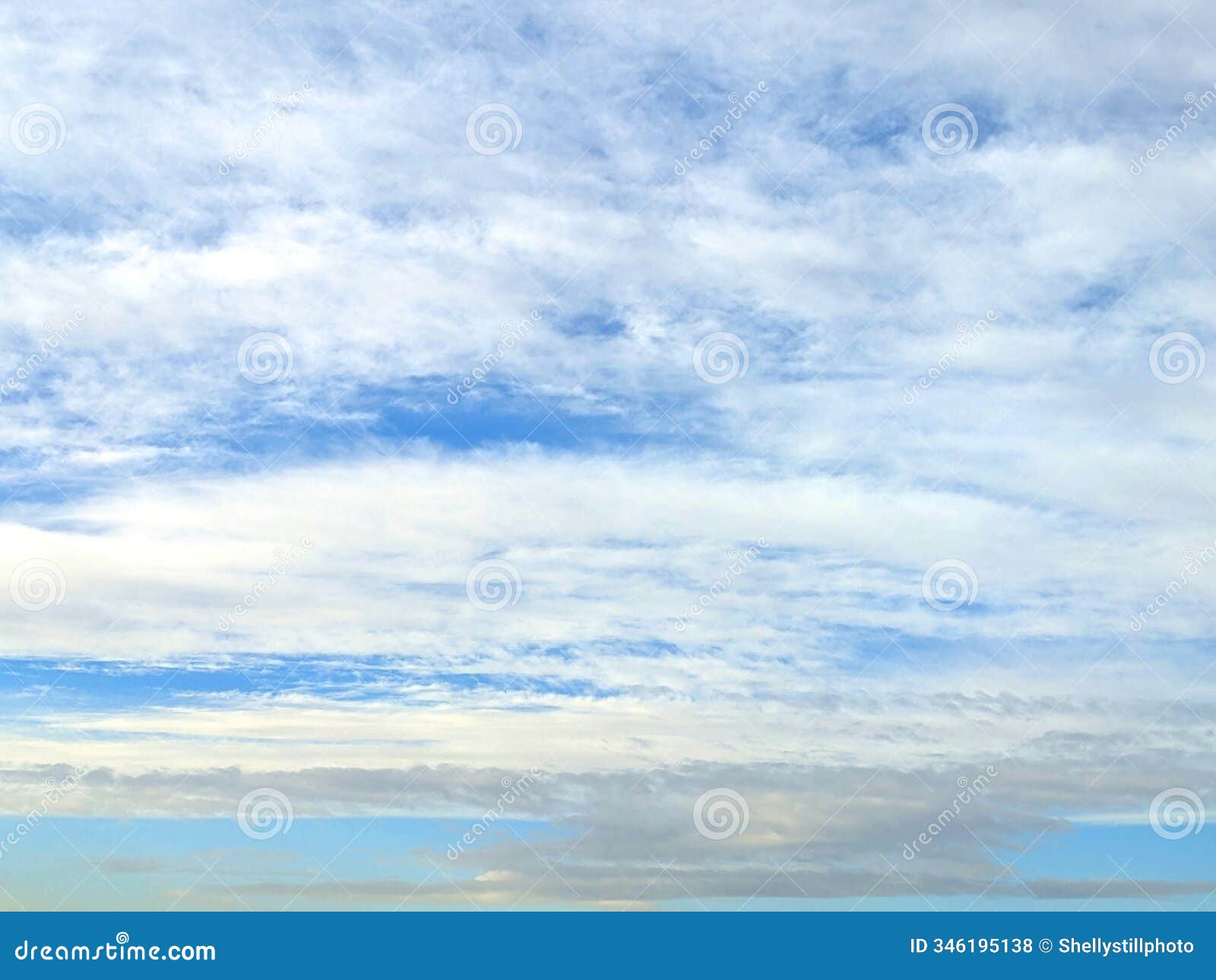 Big White Fluffy Clouds on a Blue Sky with Fine Wispy Lines Stock Photo ...