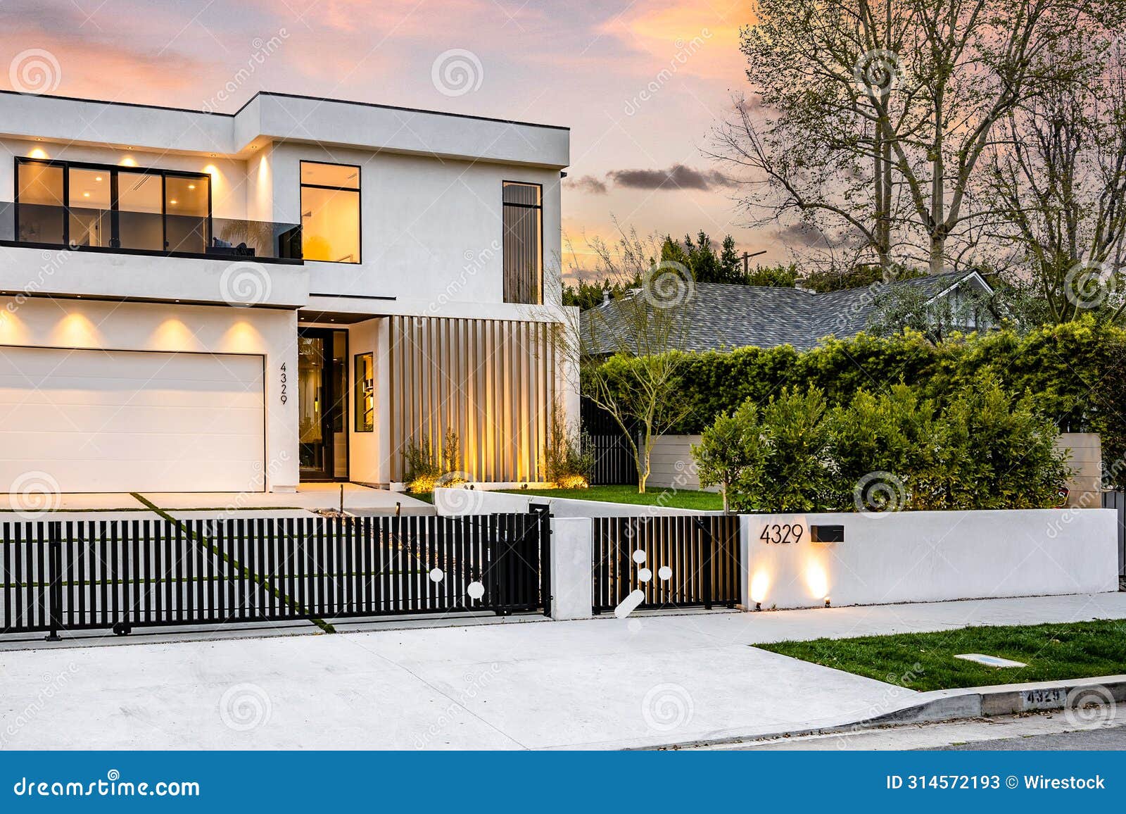 A Big White House with a Nice Gate and Some Trees Stock Image - Image ...
