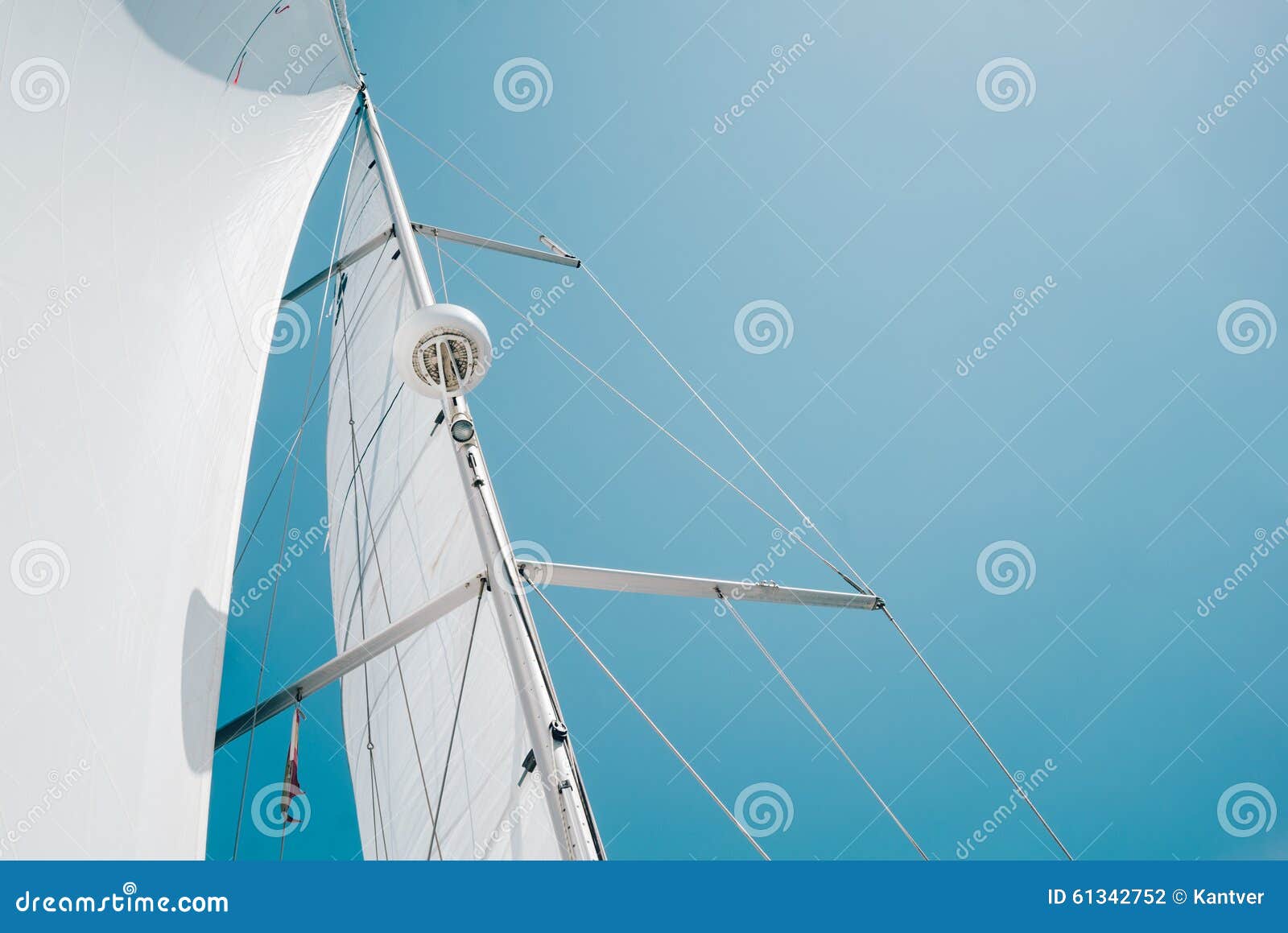 A White Jib Sail Rolled Up On The Dock With Shows A Close Up Of The ...