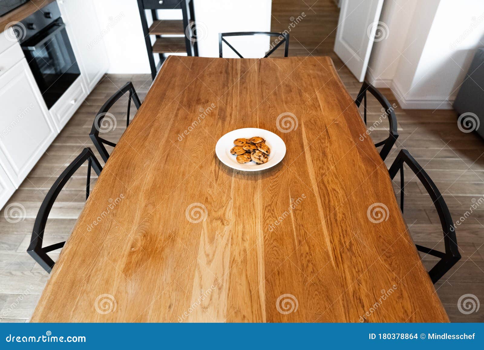 Big Wooden Table with Chairs and Cookies in the Kitchen. Lonely White ...
