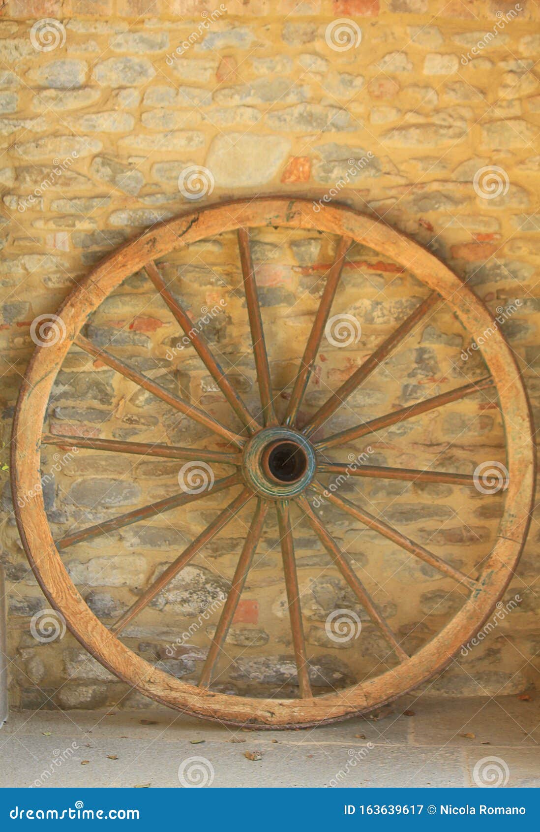 Big Wooden Wheel on the Wall Stock Image - Image of bricks, background ...