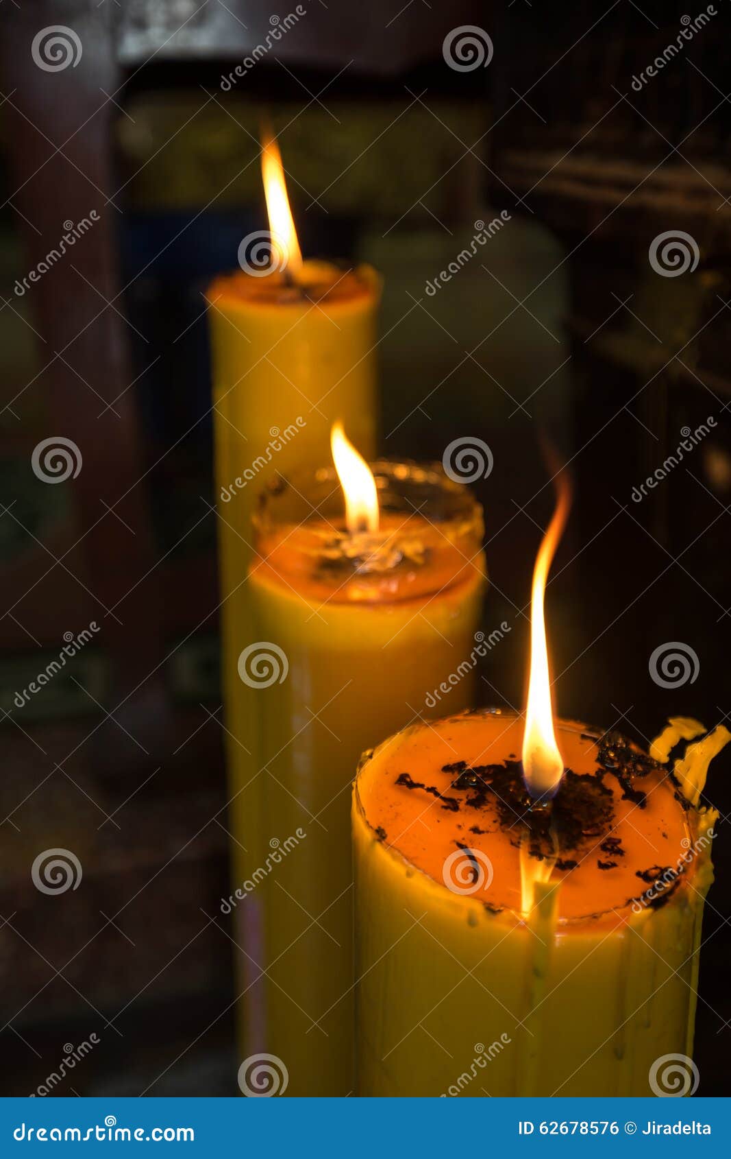 Big Yellow Candle in the Dark Stock Photo - Image of spiritual, church ...