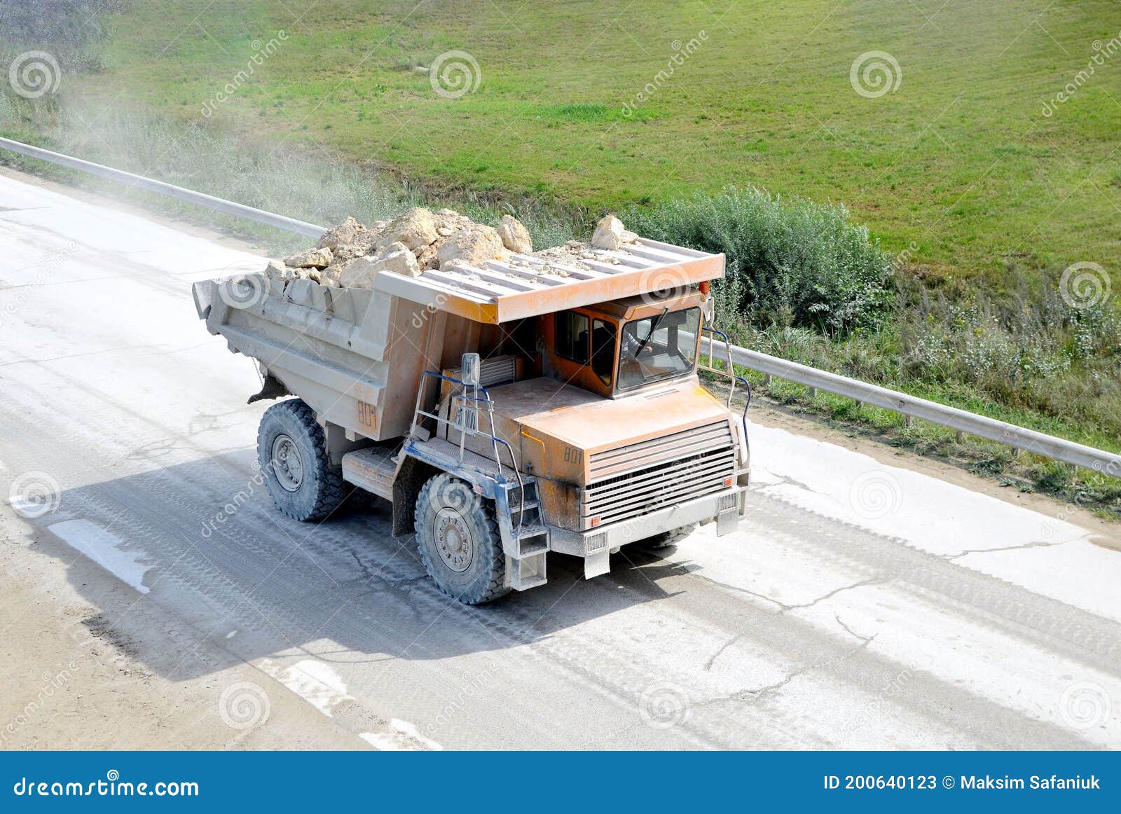 Big Yellow Dump Truck Working in the Limestone Open-pit. Loading and ...