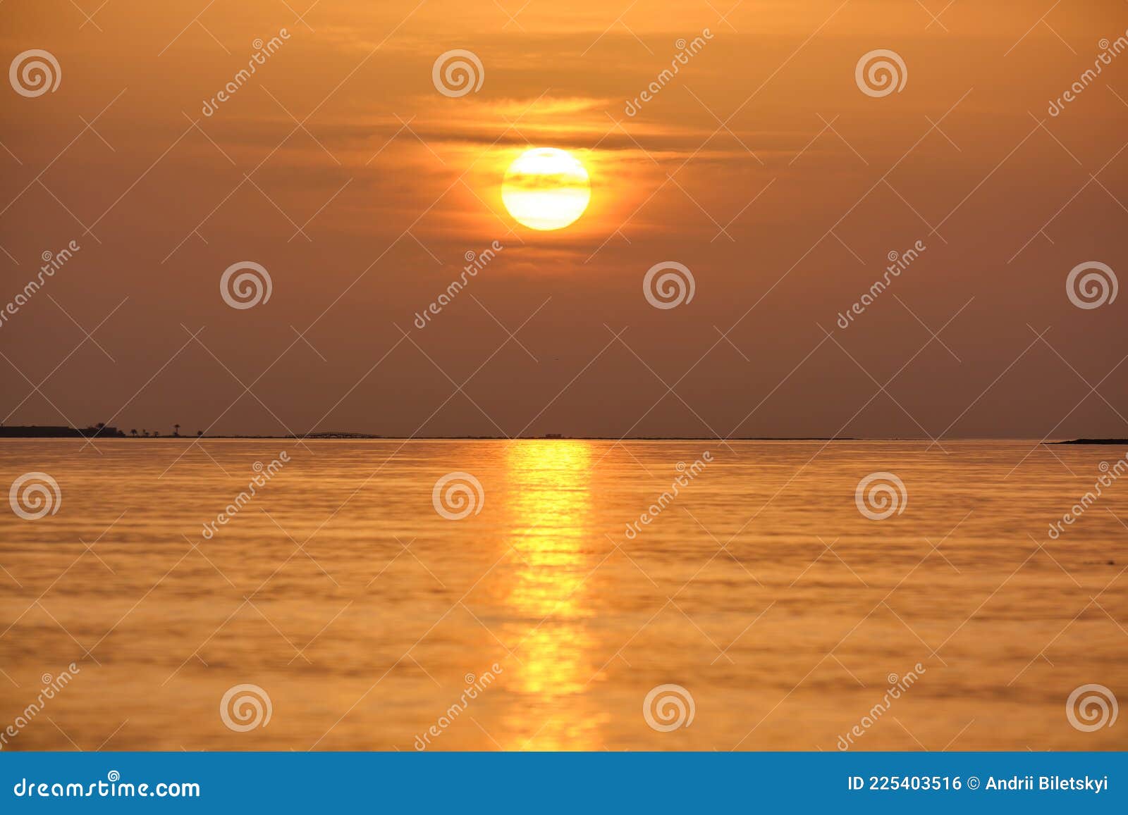 Big Yellow Sun Setting Down Over Sea Surface Stock Photo - Image of ...