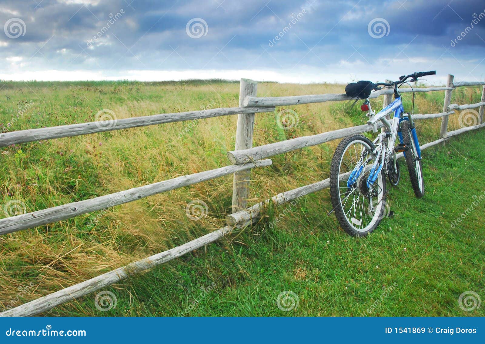 Bike Against Fence stock image. Image of bicycle, clouds - 1541869