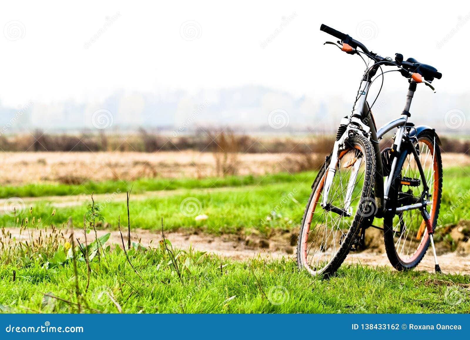 Bike in the field stock photo. Image of bike, people - 138433162