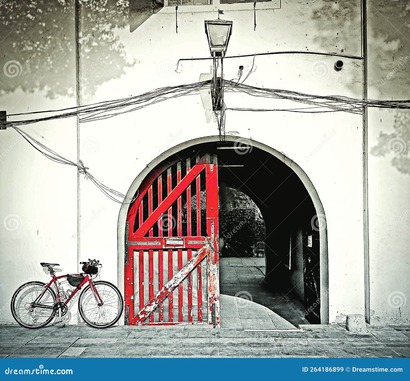 Bike in front of old gate stock image. Image of photograph - 264186899