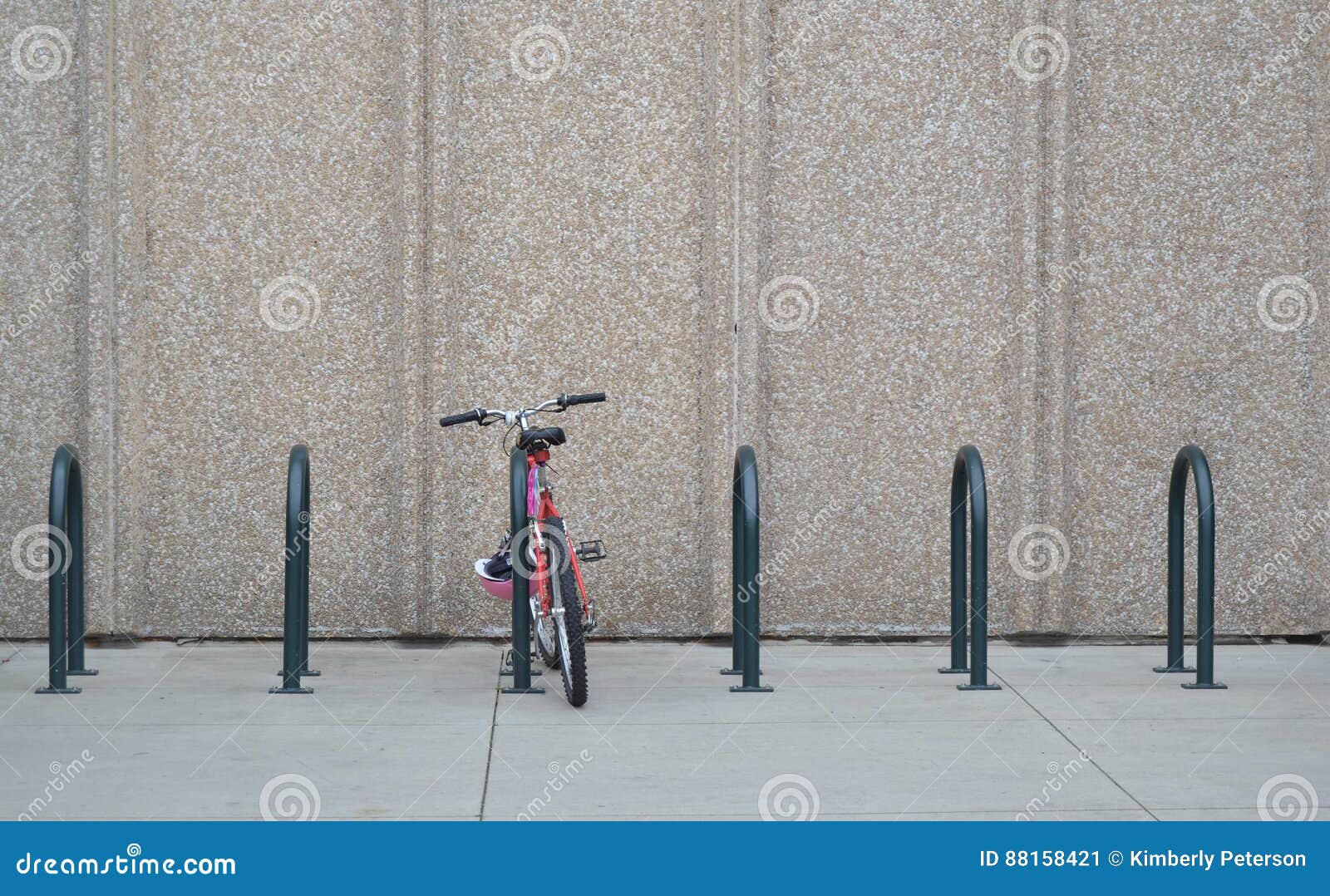 Bike Rack in Front of Concrete Wall Stock Image - Image of lock, wall ...