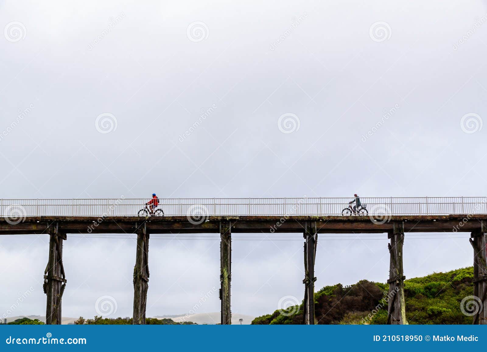 Bike riders on the bridge stock photo. Image of speed - 210518950