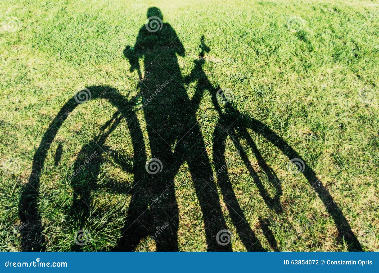 Biker and bicycle shadow stock photo. Image of cycle - 63854072