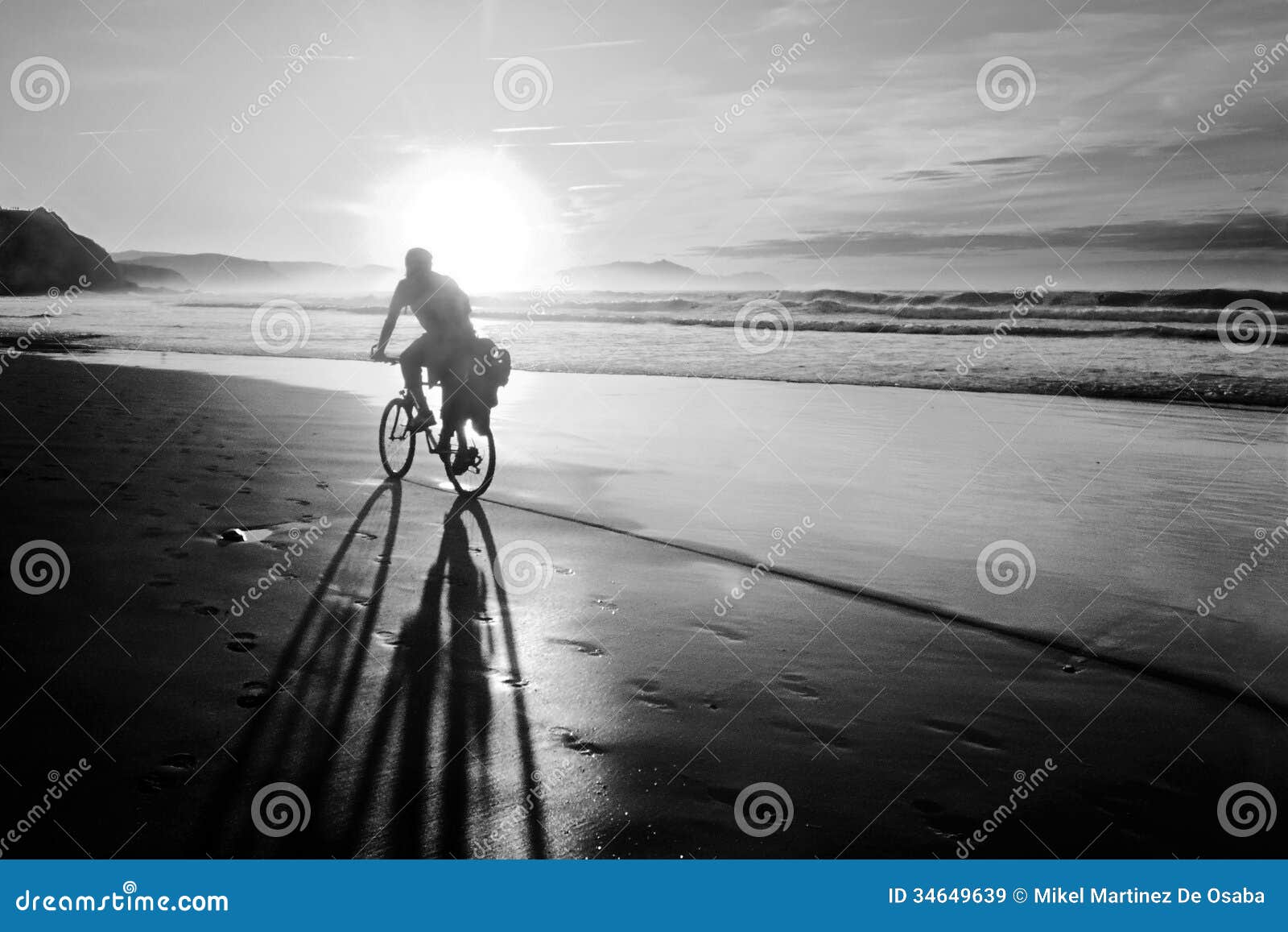 Biker Biking on Beach at Sunset with Bicycle Shadow Stock Image - Image ...