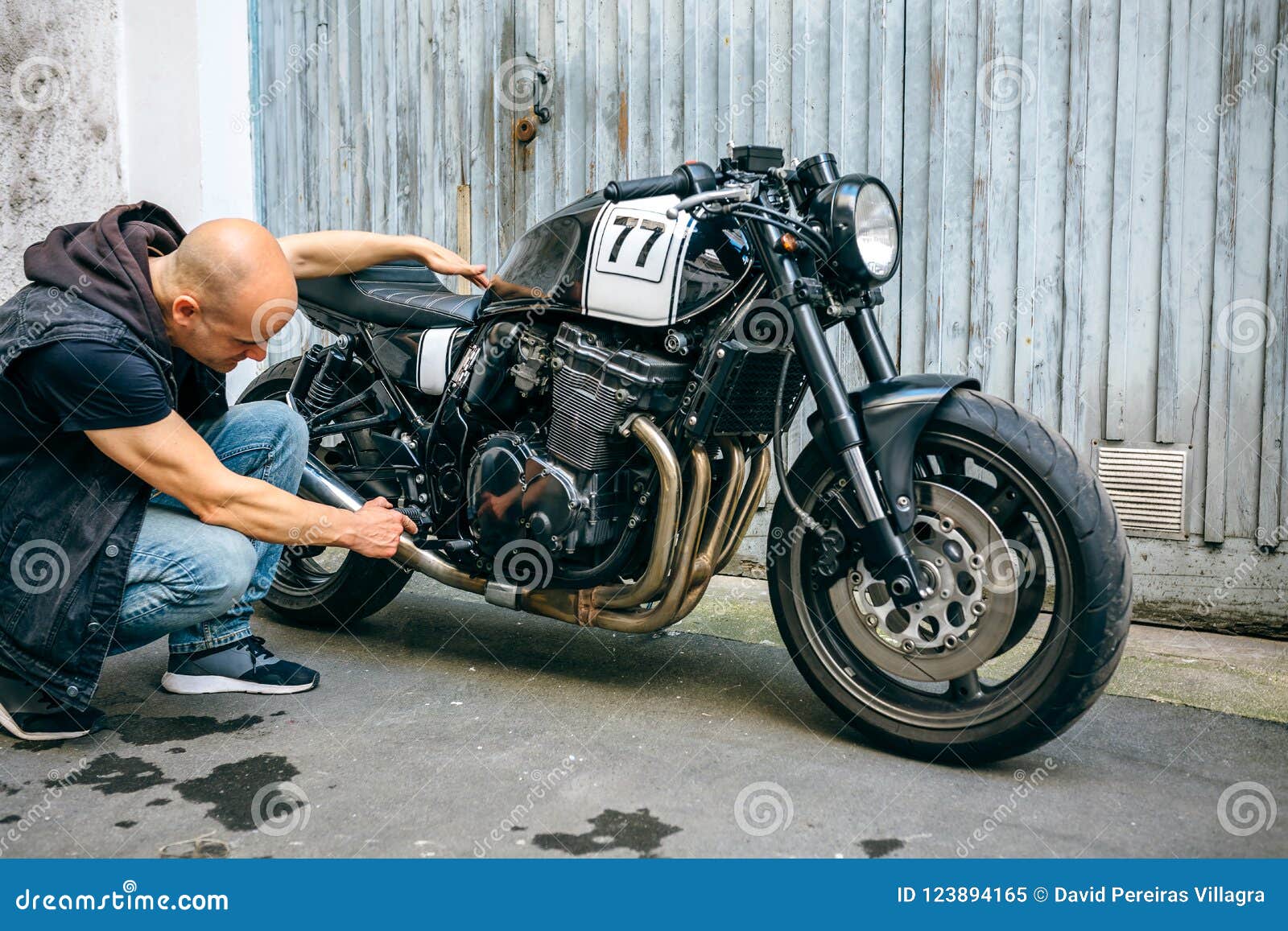Biker Checking with a Motorcycle Stock Image - Image of adult, builder ...